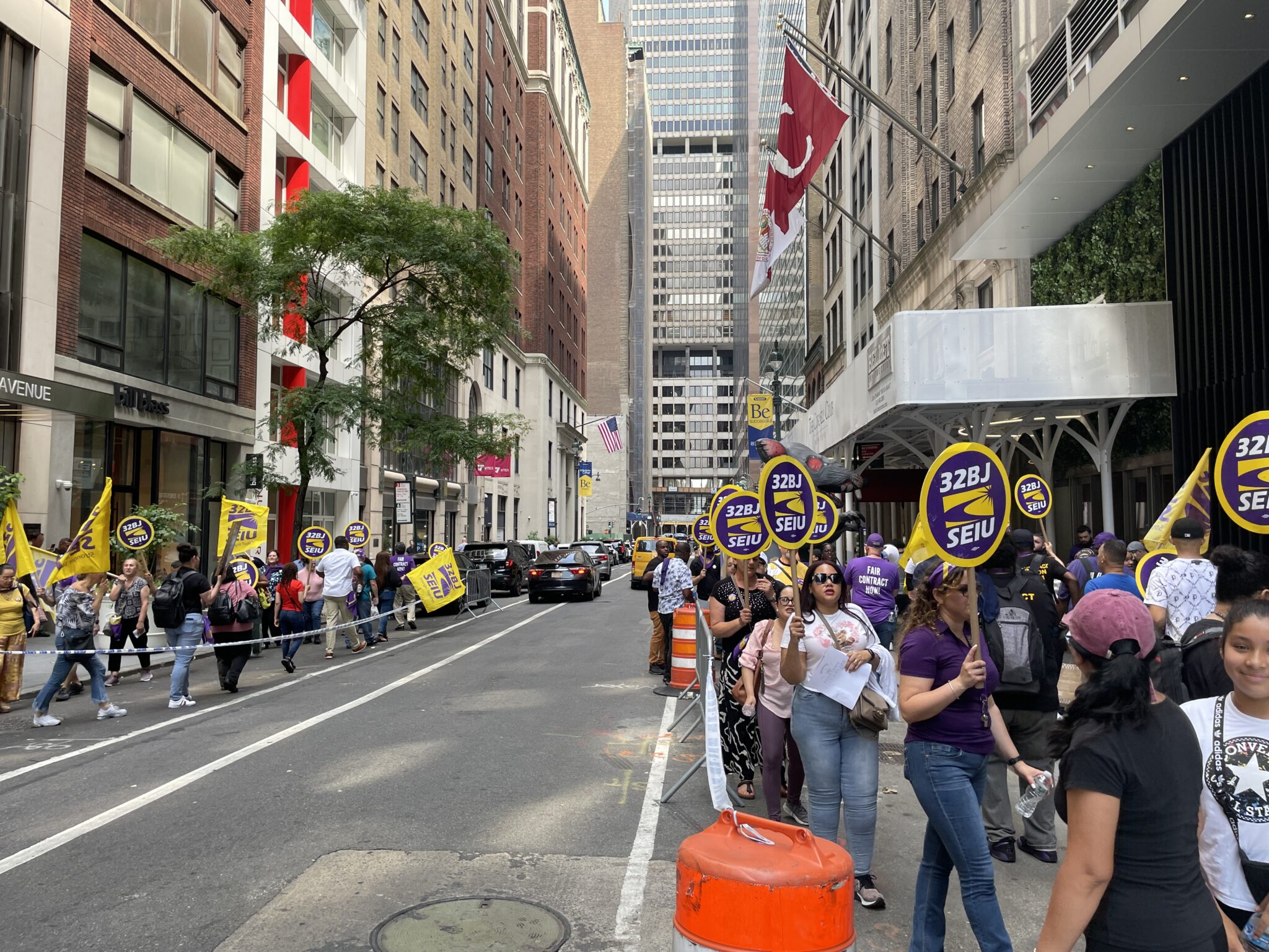 32BJ cleaners march in protest of wage cuts at Diamond District ...